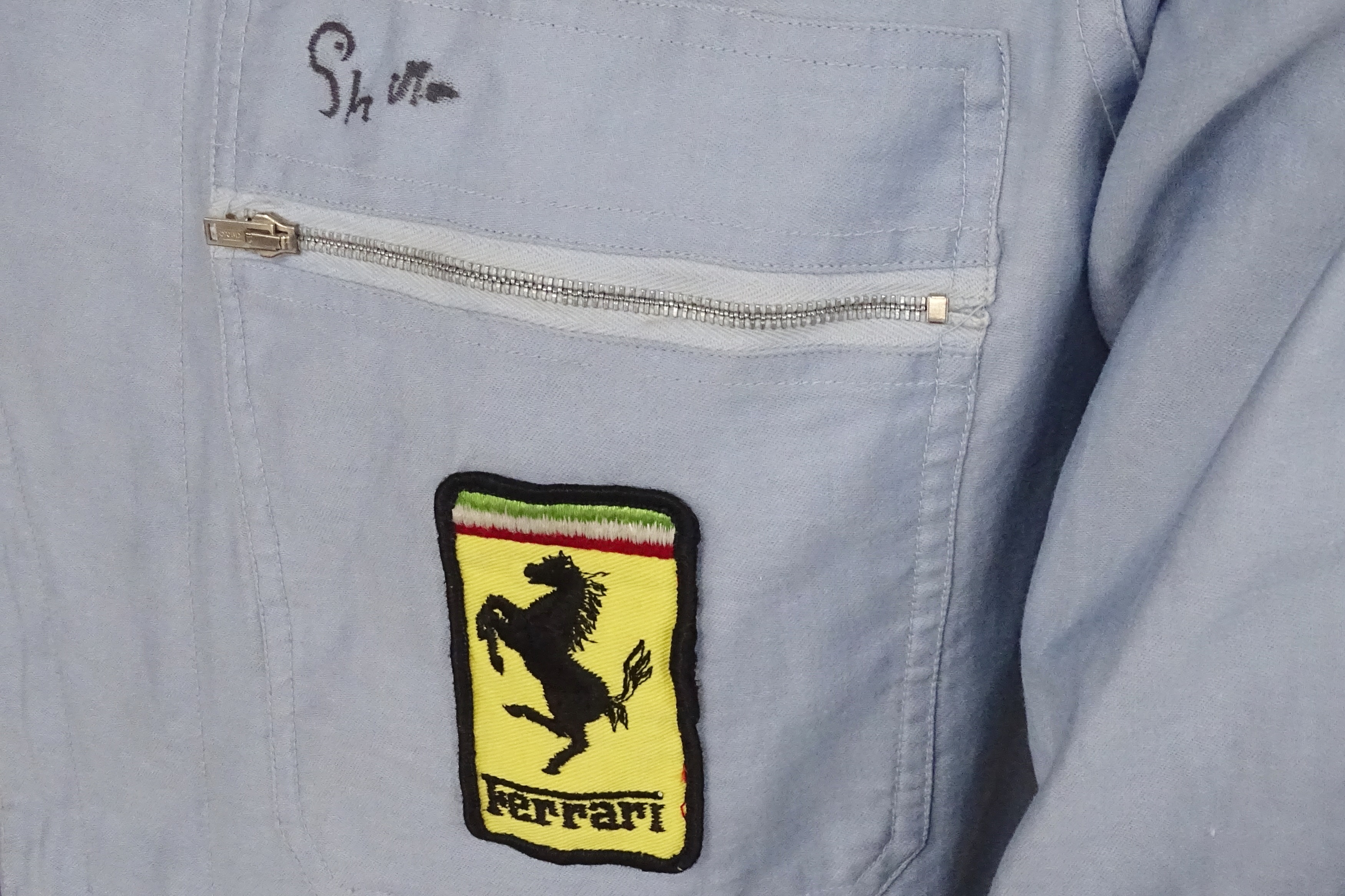 Lot 53 - Original Sir Stirling Moss race suit on